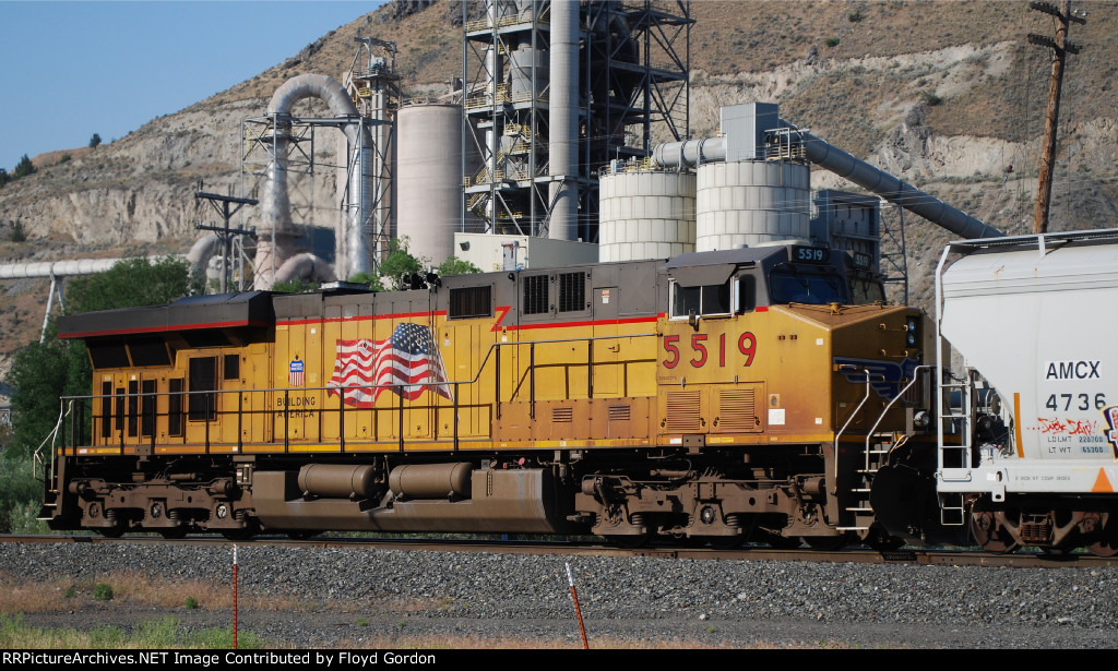 UP 5519 DPU passes cement plant as it travels west